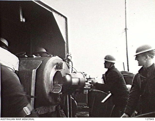 BARDIA, LIBYA. 1941-01-02. ABOARD THE HMS LADYBIRD GUNNERS LOADING ONE ...