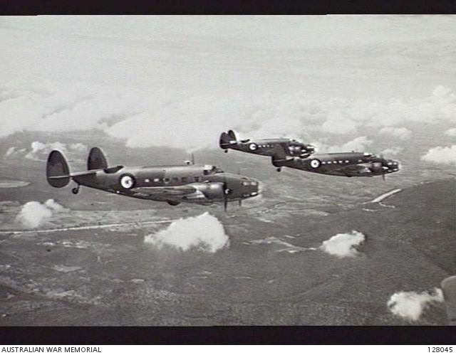 Three RAAF Lockheed Hudsons in flight somewhere over Australia, each ...