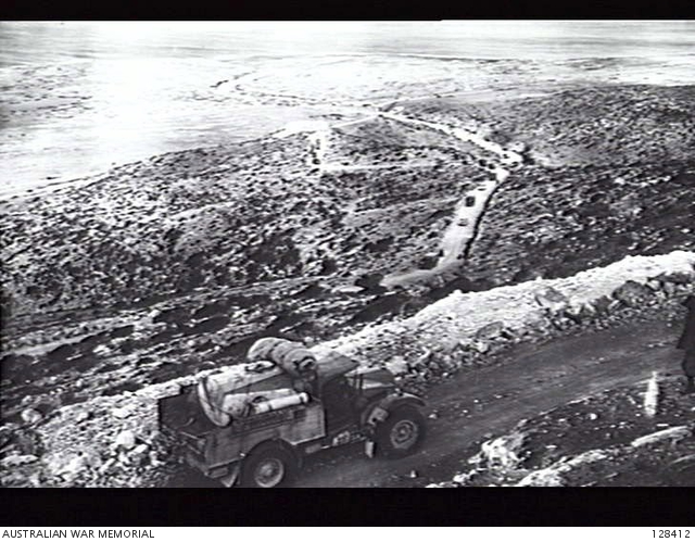 DERNA, CYRENAICA. 1941-02-05. TRUCKS WINDING UP THE ESCARPMENT FROM ...
