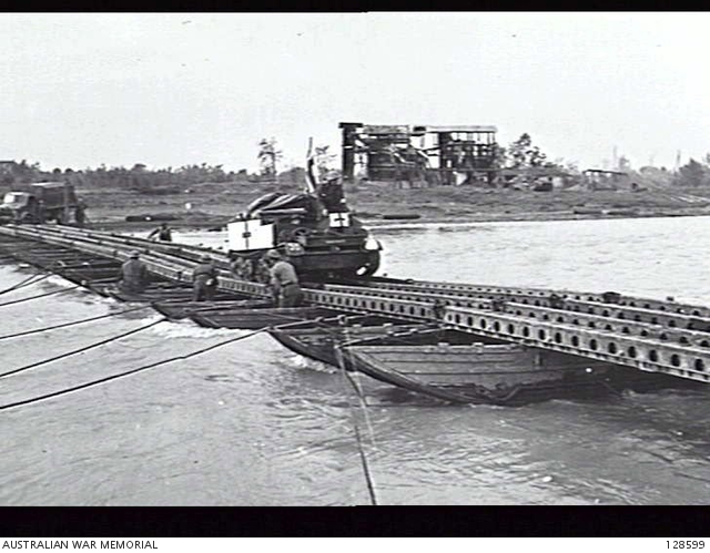 ITALY. 1944-11. AN AMBULANCE CARRIER CROSSES THE RIVER RONCO USING A ...