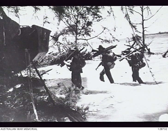 LABUAN ISLAND.1945-06-10. MEN OF THE 24TH INFANTRY BRIGADE WADING ...