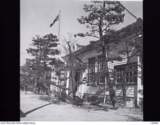 KURE, JAPAN. 1946-04-08. FRONT ENTRANCE TO OFFICE BUILDINGS AT ...
