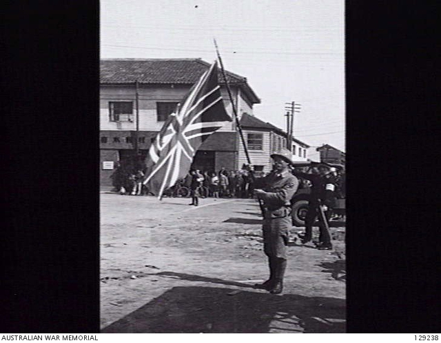 MATSUE, JAPAN. 1946-04-28. A JAPANESE CIVILIAN CARRYING THE BRITISH ...