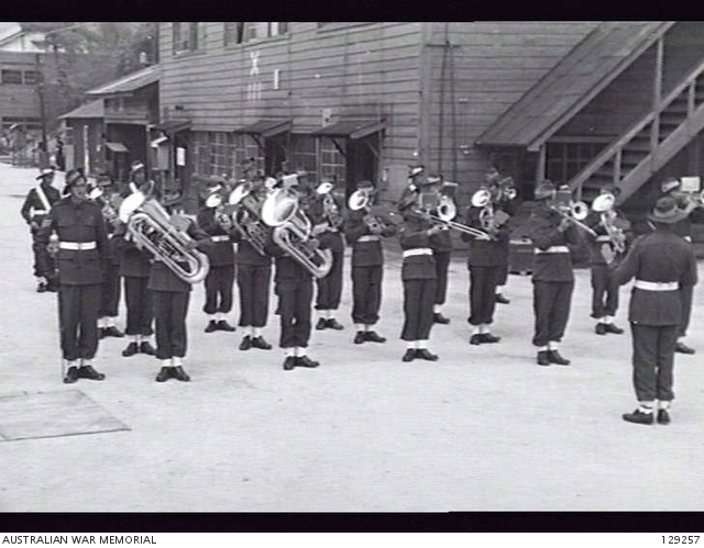 KURE, JAPAN. 1946-04-30. BAND OF 34TH INFANTRY PROVIDE MUSIC FOR THE ...