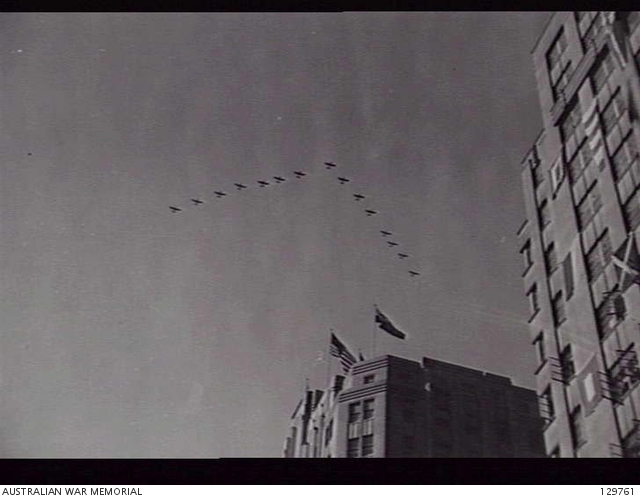 Royal Navy fighter aircraft fly in V formation over Martin Place ...