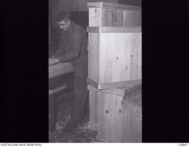 Carpenter N456864 Sapper Cyril John Doherty planes a piece of oregon ...