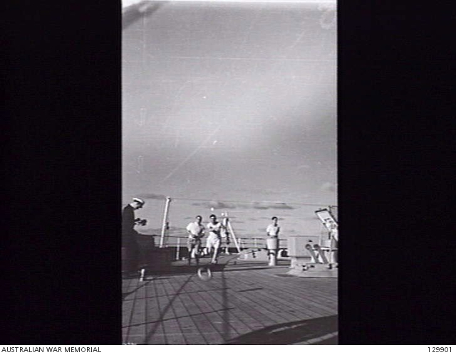 Naval Officers of the Victory Contingent enjoy a game of deck quoits on ...