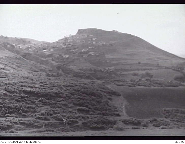 DOMOKOS, GREECE. 1945-04-24. DOMOKOS VILLAGE SEEN FROM THE MAIN ROAD ...