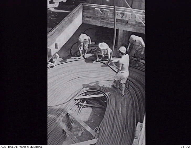 AKIZUKI, JAPAN. 1946-08-09. JAPANESE LABOURERS COILING CABLE BEING ...