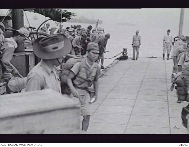 UJINA, JAPAN. 1946-06-27. JAPANESE REPATRIATES COMING ASHORE AT THE ...