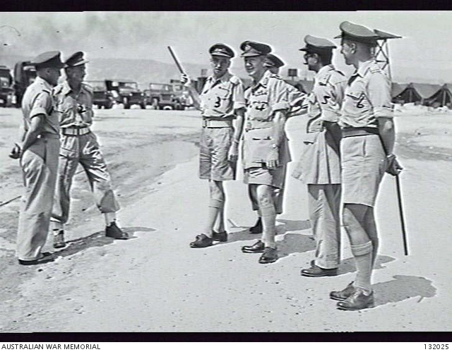 KURE, JAPAN. 1946-08-02. LIEUTENANT COLONEL J. C. TURNER POINTING OUT ...