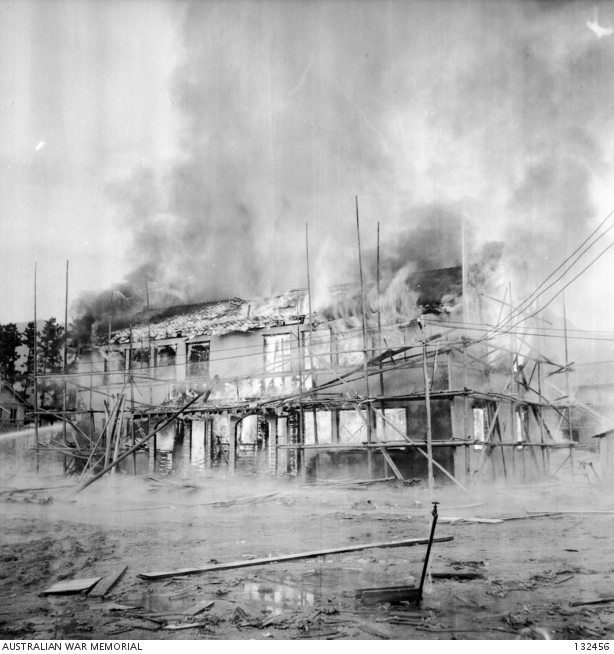 ETA JIMA, JAPAN. 11 January 1946. FLAMES LEAP FROM A BUILDING IN A FIRE ...