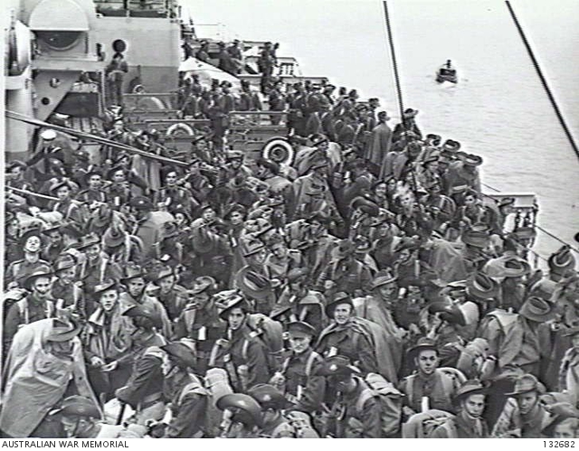 KURE, JAPAN. 1946-12-02. NEWLY ARRIVED BCOF TROOPS PREPARE TO DISEMBARK ...