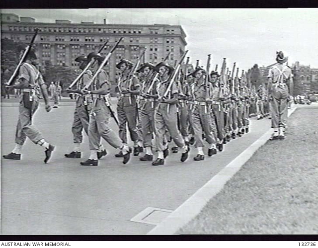TOKYO, JAPAN. 1947-04. NO 1 GUARD MARCHING ONTO THE PLAZA NEAR THE ...