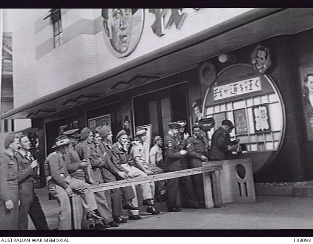 KYOTO, JAPAN. 1947-08. BCOF TROOPS ON LEAVE LINE UP AT THE BOX OFFICE ...