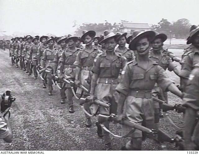 TOKYO, JAPAN. 1947. GHURKAS MARCH PAST THE SALUTING BASE DURING REVIEW ...