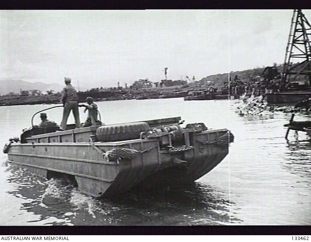 LAE, NEW GUINEA. 1943-10-01. THREE TON AMPHIBIOUS TRUCK ENTERING THE ...