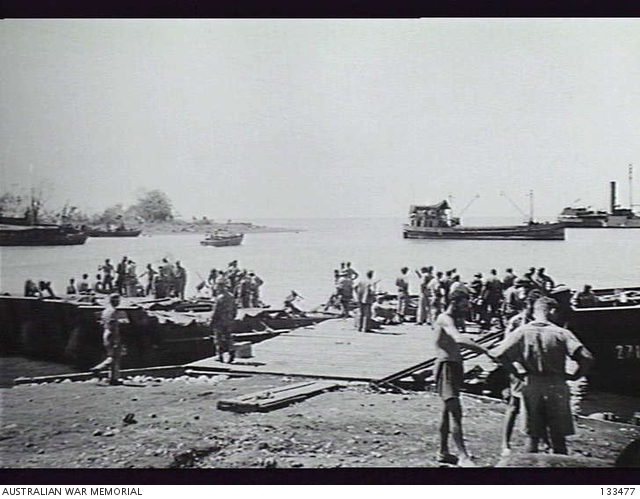 LAE, NEW GUINEA. 1943-09-30. UNLOADING LANDIND CRAFT VEHICLES (LCVS) AT ...