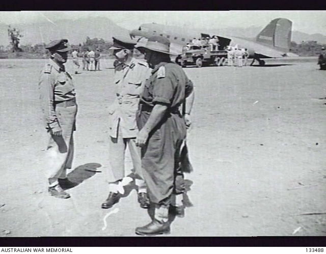 LAE, NEW GUINEA. 1943-10-01. TALKING ON THE AIR STRIP ARE BRIGADIER ...