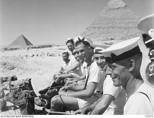 C.1940. RAN SAILORS AS TOURISTS, ON CAMELS BESIDE THE PYRAMIDS ...