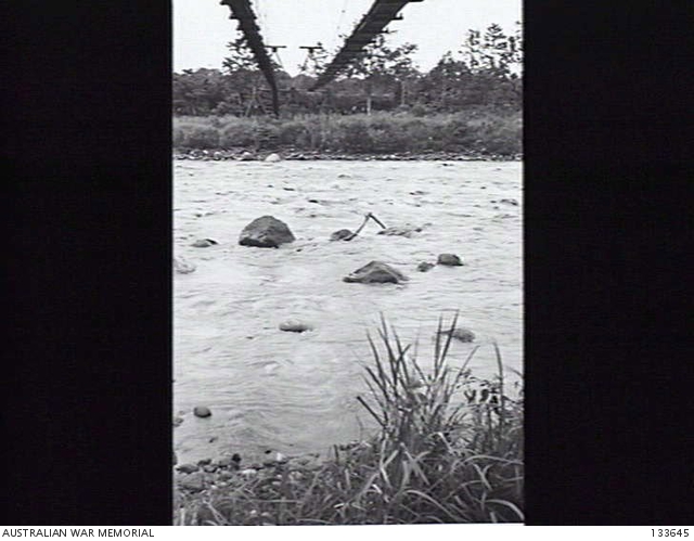 LAE, NEW GUINEA. 1946-01-28. THE BUSU RIVER, SHOWING THE SUSPENSION ...