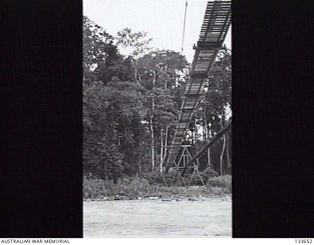 LAE, NEW GUINEA. 1946-01-28. THE SUSPENSION BRIDGE OVER THE BUSU RIVER ...