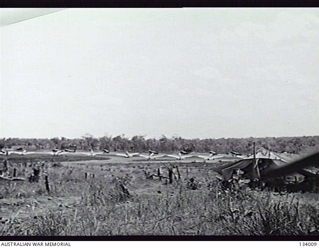 DARWIN, NT. 1942-08. KITTYHAWK (P40'S) READY TO TAKE OFF AT BATCHELOR ...