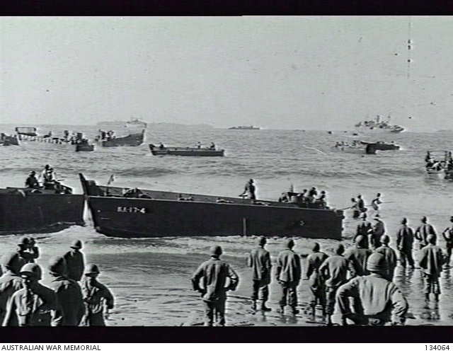 BROACHED SMALL LANDING CRAFT SHOWS DIFFICULTIES CONFRONTED BY US TROOPS ...