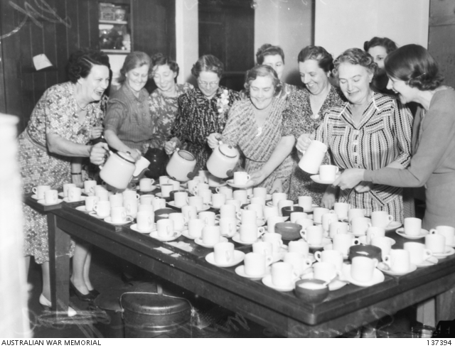 MELBOURNE, VIC. 1942-12-15. MEMBERS OF THE WOMEN'S NAVY LINK POURING ...