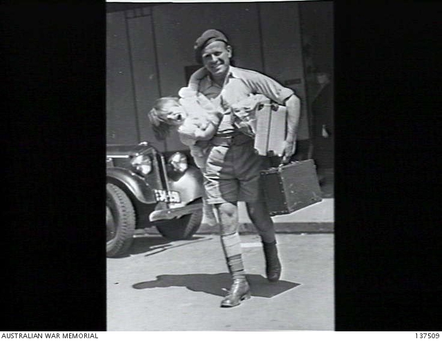 MELBOURNE, VIC. 1942-12-21. CORPORAL JACK BOWDEN AIF MANAGES A SMILE AS ...