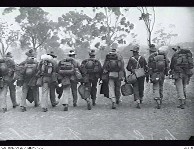 VIC. 1943-02-17. BEDRAGGLED, BATTLE WEARY AND LOADED WITH GEAR, THESE ...