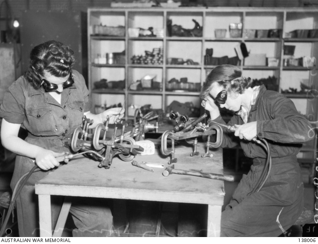 MELBOURNE, VIC. 1943-02-26. WOMEN WELDERS WELDING JIGGED UP AIRCRAFT ...
