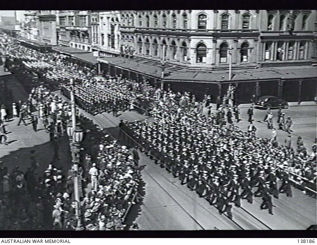 MELBOURNE, VIC. 1943-03-19. WATCHED BY CROWDS LINING THE BARRICADES ...