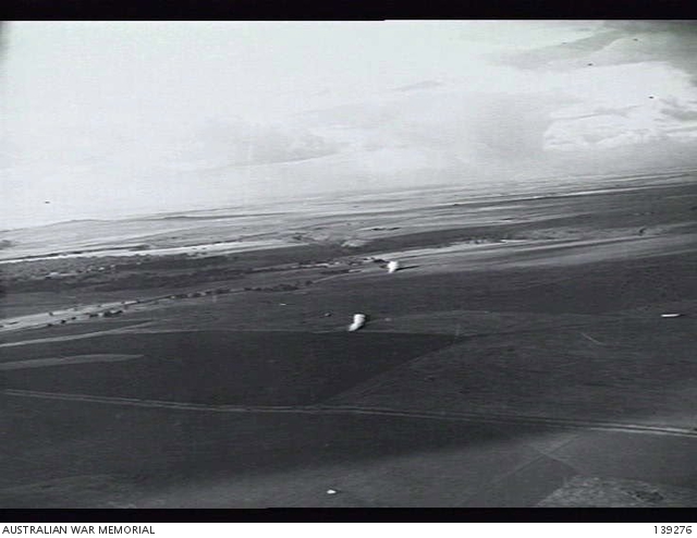 Victoria. 1943-07-08. Practice bombs bursting on a RAAF bombing range ...