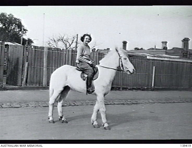 HEIDELBERG, VIC. 1943-08-06. MRS FLYNN, A MUNITIONS WORKER, RIDING HER ...