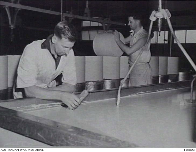 VICTORIA. 1943-10-01. AN EMPLOYEE OF THE KORUMBURRA BUTTER FACTORY ...