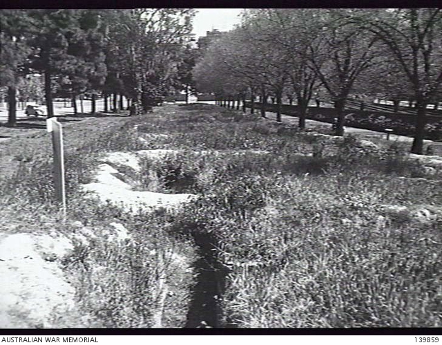 MELBOURNE, VIC. 1943-10-12. AIR RAID TRENCHES AT JOLIMONT PARK ...