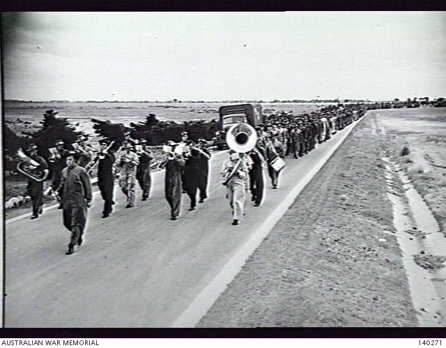 POINT COOK, VIC. 1944-01-11. MEMBERS OF THE RAAF, LED BY THEIR BAND IN ...