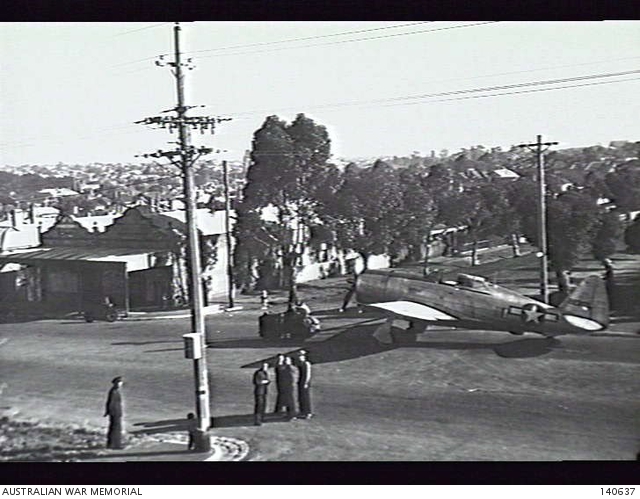 Melbourne, Vic. 1944-03-20. Ground staff members of the RAAF towing a ...