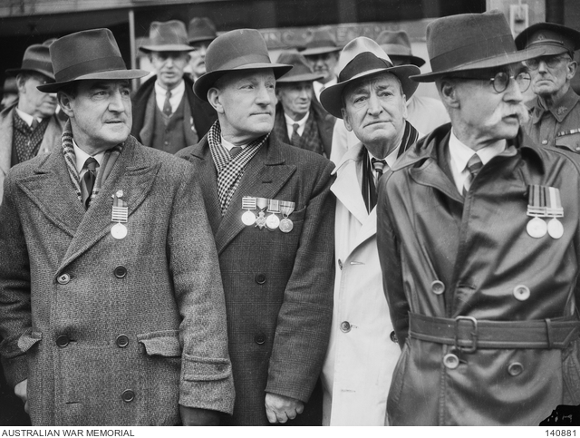 Ex-servicemen watching the Anzac Day March through the city streets ...