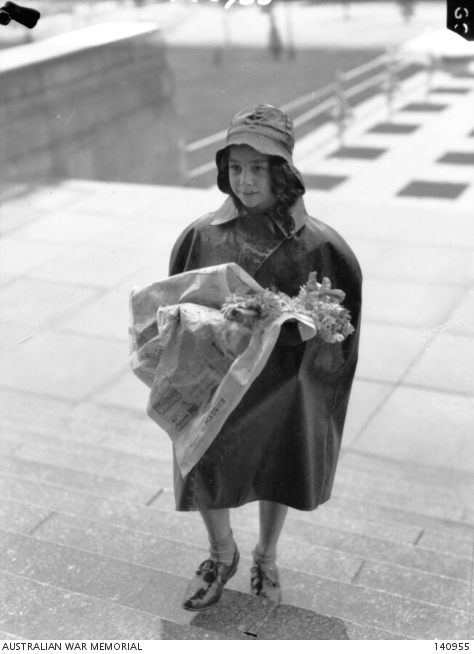 Melbourne, Vic. 1944-04-25. Wearing a sou'wester and waterproof cape to ...