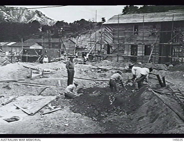 Eta Jima, Japan. 1947-10-31. Japanese labourers mixing cement at the ...