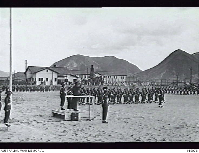 Hiro, Japan. 1947-11-20. Brigadier A. R. Garrett, CBE, takes the salute ...
