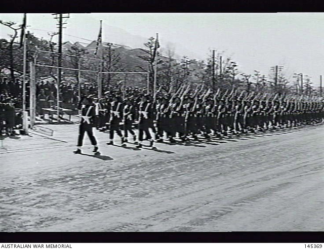Kure, Japan. 1948-02-20. 66th Infantry Battalion marches past the ...