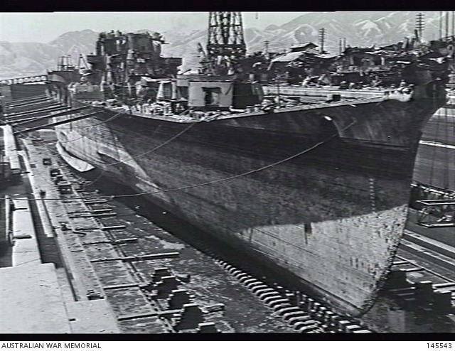 Kure, Japan. 1948-07-01. Japanese Navy ship Tone in dry dock at Kure ...