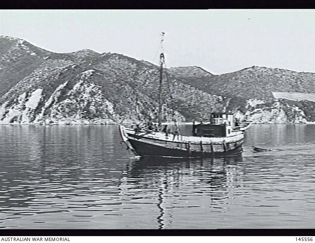 Kure, Japan. 1948-07-01. Japanese labourers on board a barge loaded ...
