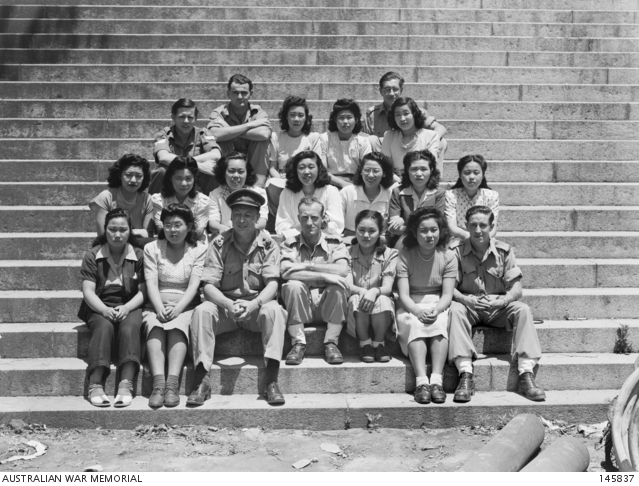 Kure, Japan. 1948-09-08. A group portrait of officers and Japanese ...