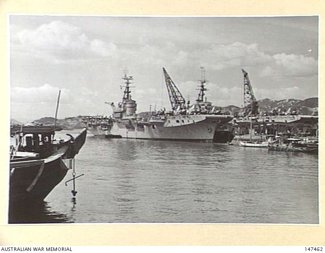 KURE, JAPAN, 1951-09. AIRCRAFT CARRIERS HMAS SYDNEY (CENTRE) AND HMS ...