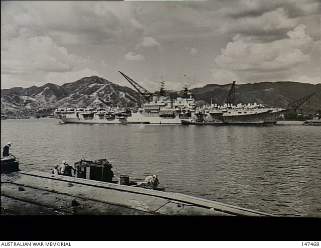 Kure, Japan. 1951-09-29. Side view of HMAS Sydney berthed at Finger ...