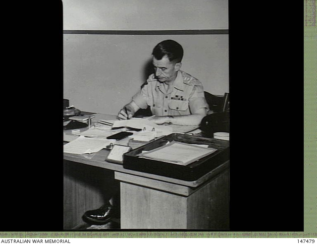 Kure, Japan. 1951. Sitting and working at his desk is 3/40028 ...